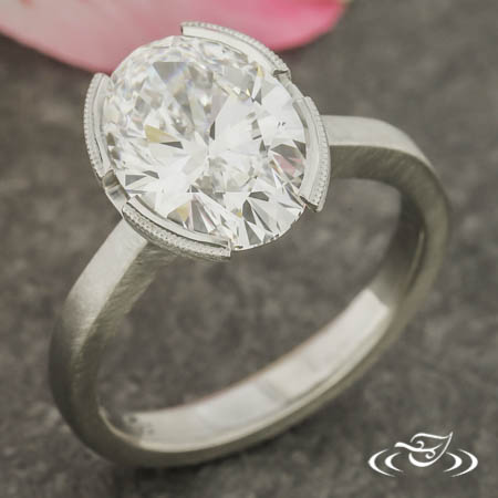 Half Bezel Set Oval Diamond Ring